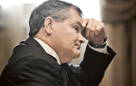 Reed chief resigns as company takes $70m hit